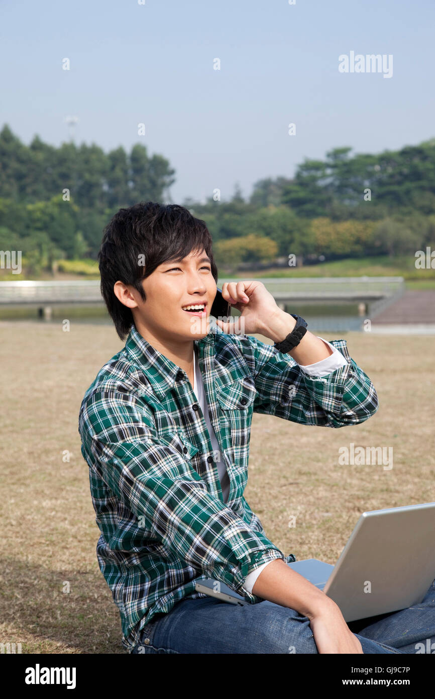 Young college students in a park outing Stock Photo - Alamy