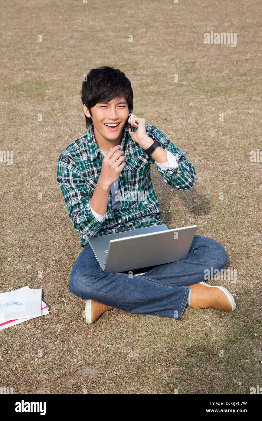 Young college students in a park outing Stock Photo - Alamy