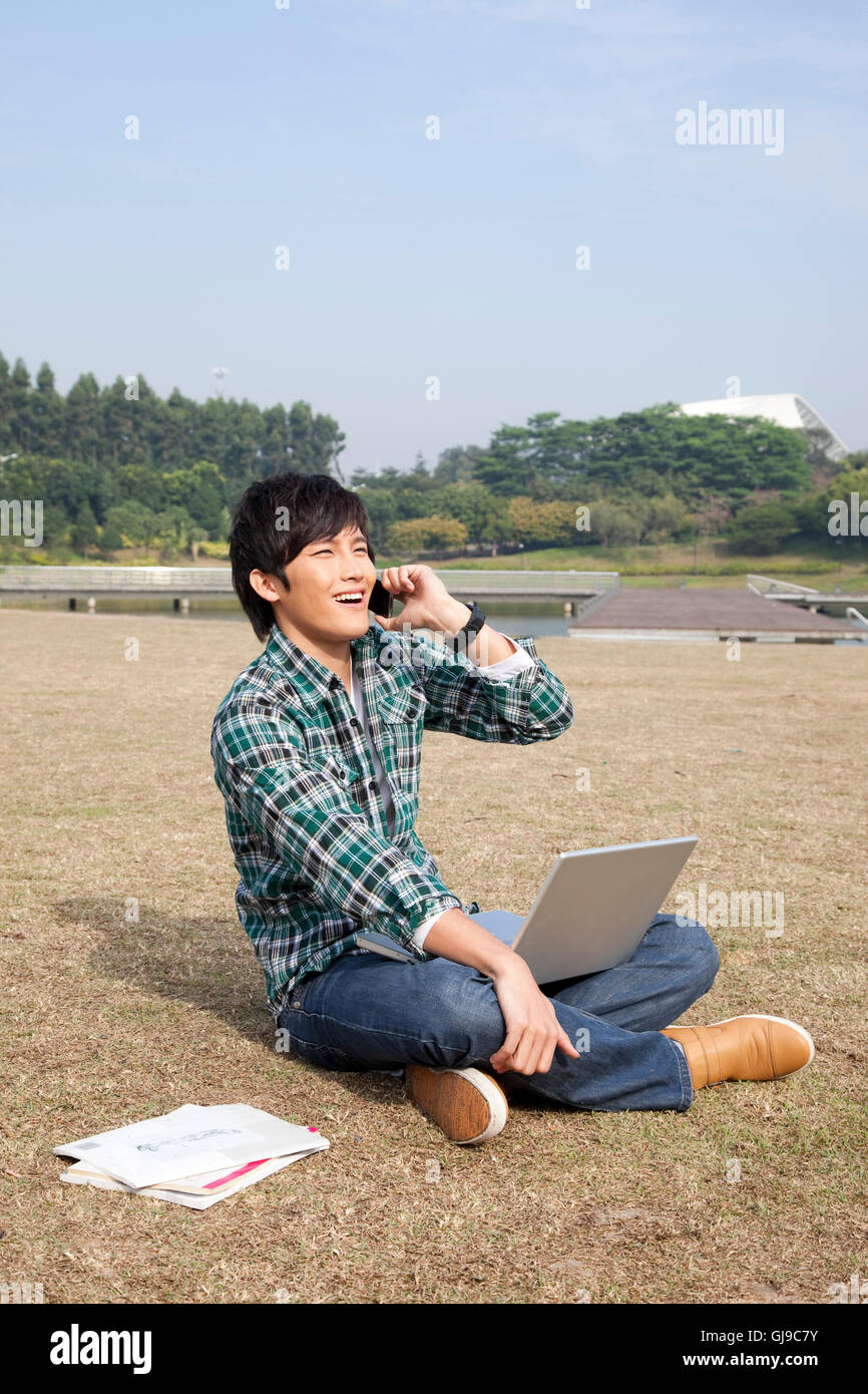 Young college students in a park outing Stock Photo - Alamy