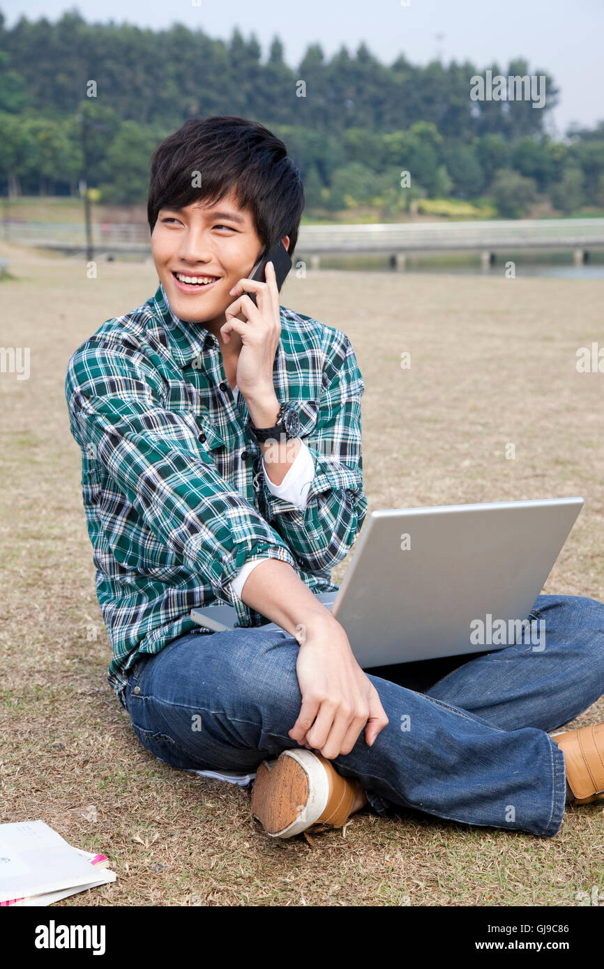 Young college students in a park outing Stock Photo - Alamy