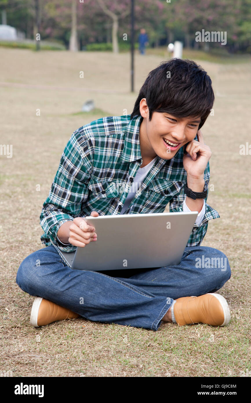 Young college students in a park outing Stock Photo - Alamy