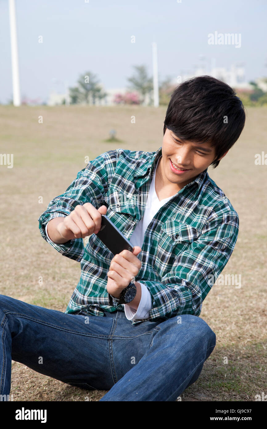 Young college students in a park outing Stock Photo - Alamy