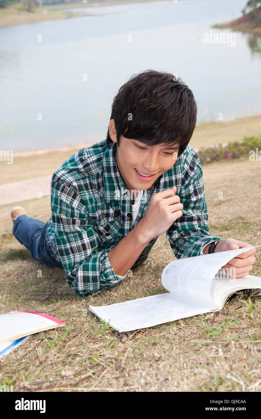 Young college students in a park outing Stock Photo - Alamy