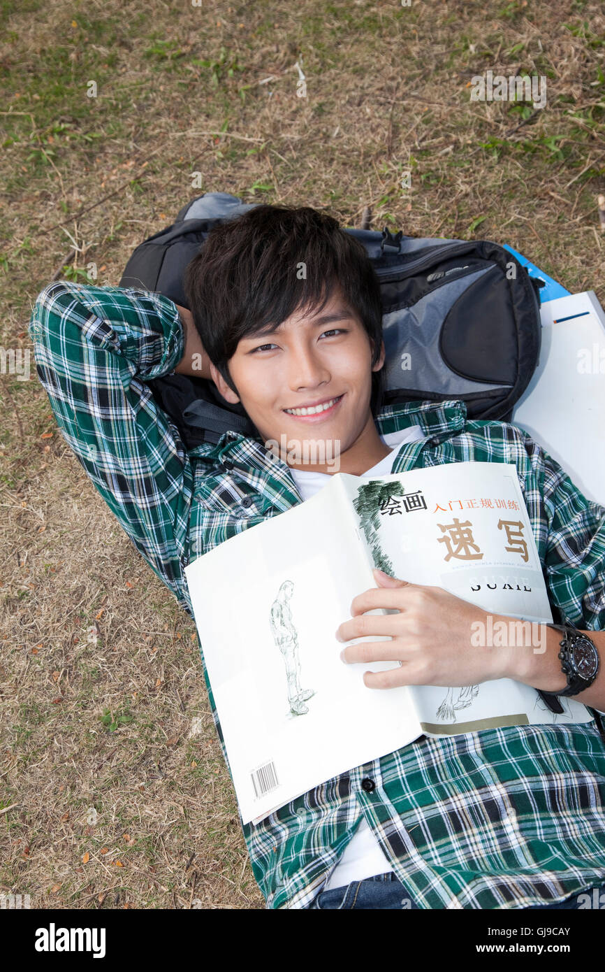 Young college students in a park outing Stock Photo - Alamy