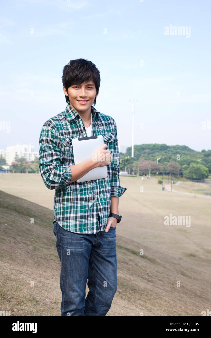 Young college students in a park outing Stock Photo - Alamy
