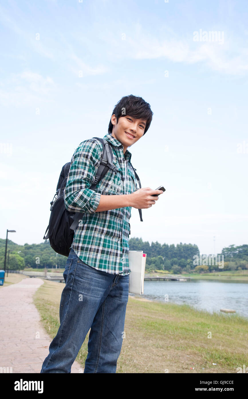 Young college students in a park outing Stock Photo - Alamy