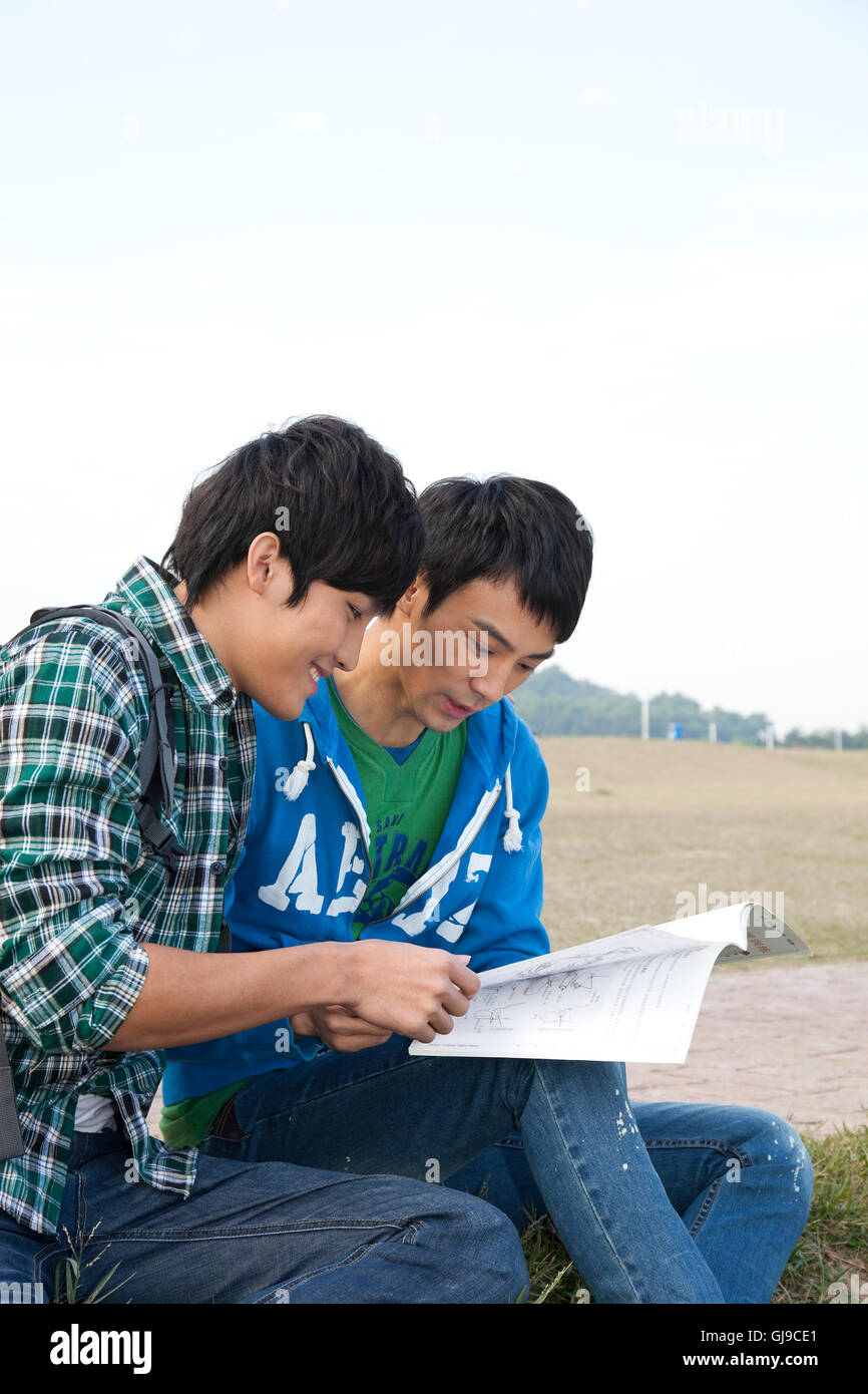 Young college students in a park outing Stock Photo - Alamy