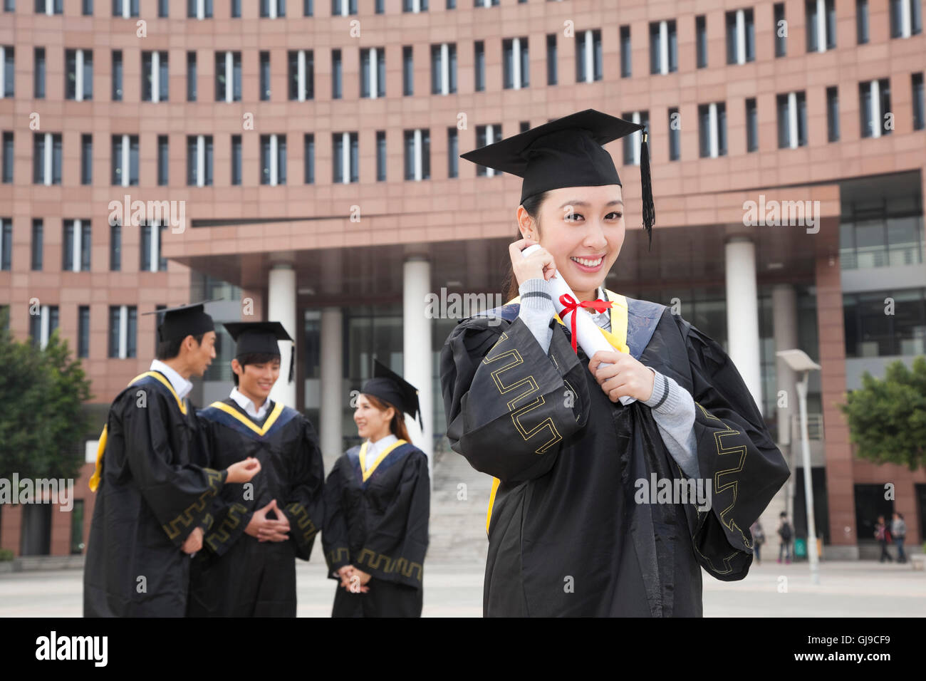 Young university student campus graduation ceremony Stock Photo - Alamy