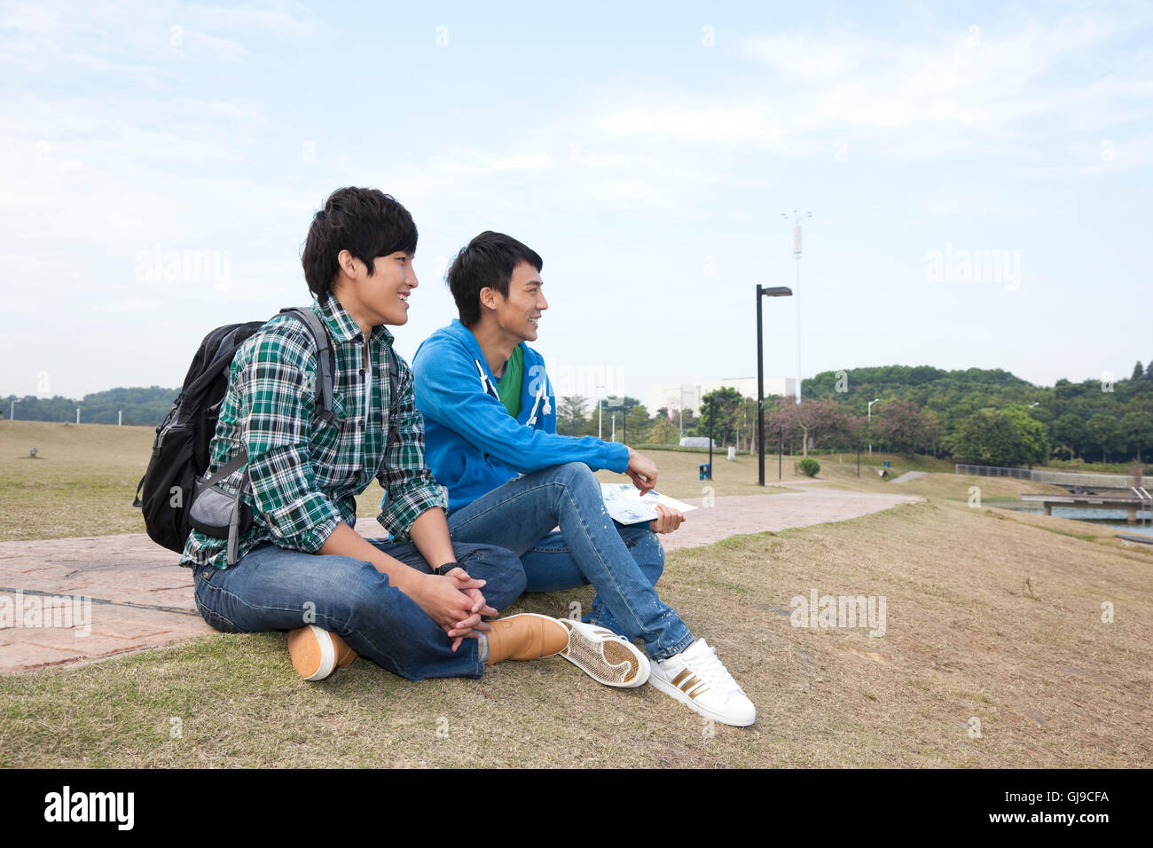Young college students in a park outing Stock Photo - Alamy