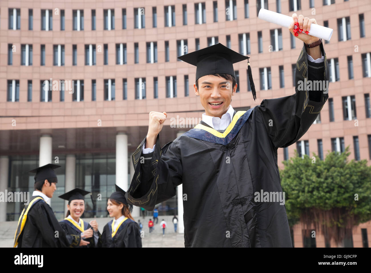 Young university student campus graduation ceremony Stock Photo - Alamy
