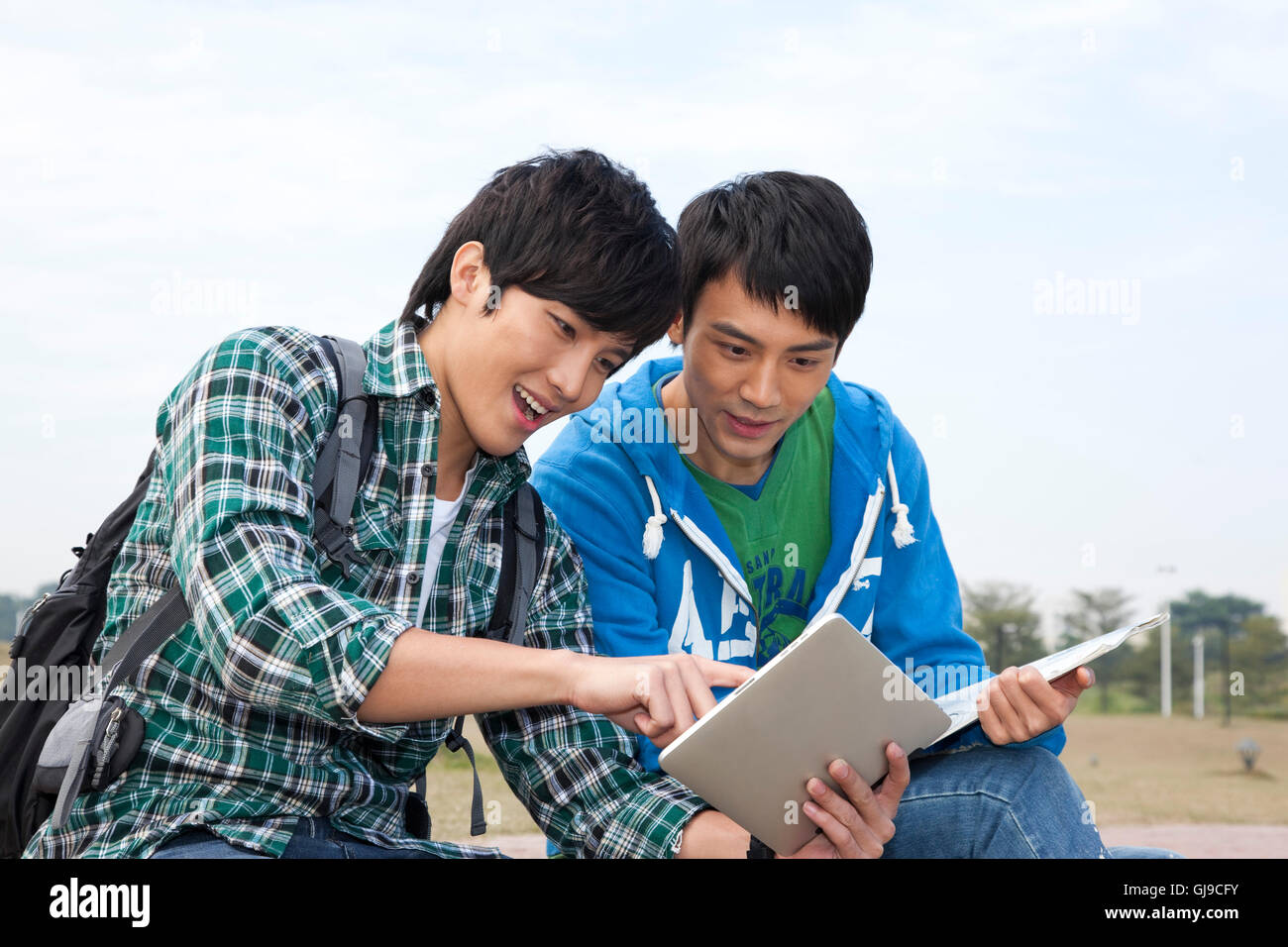 Young college students in a park outing Stock Photo - Alamy