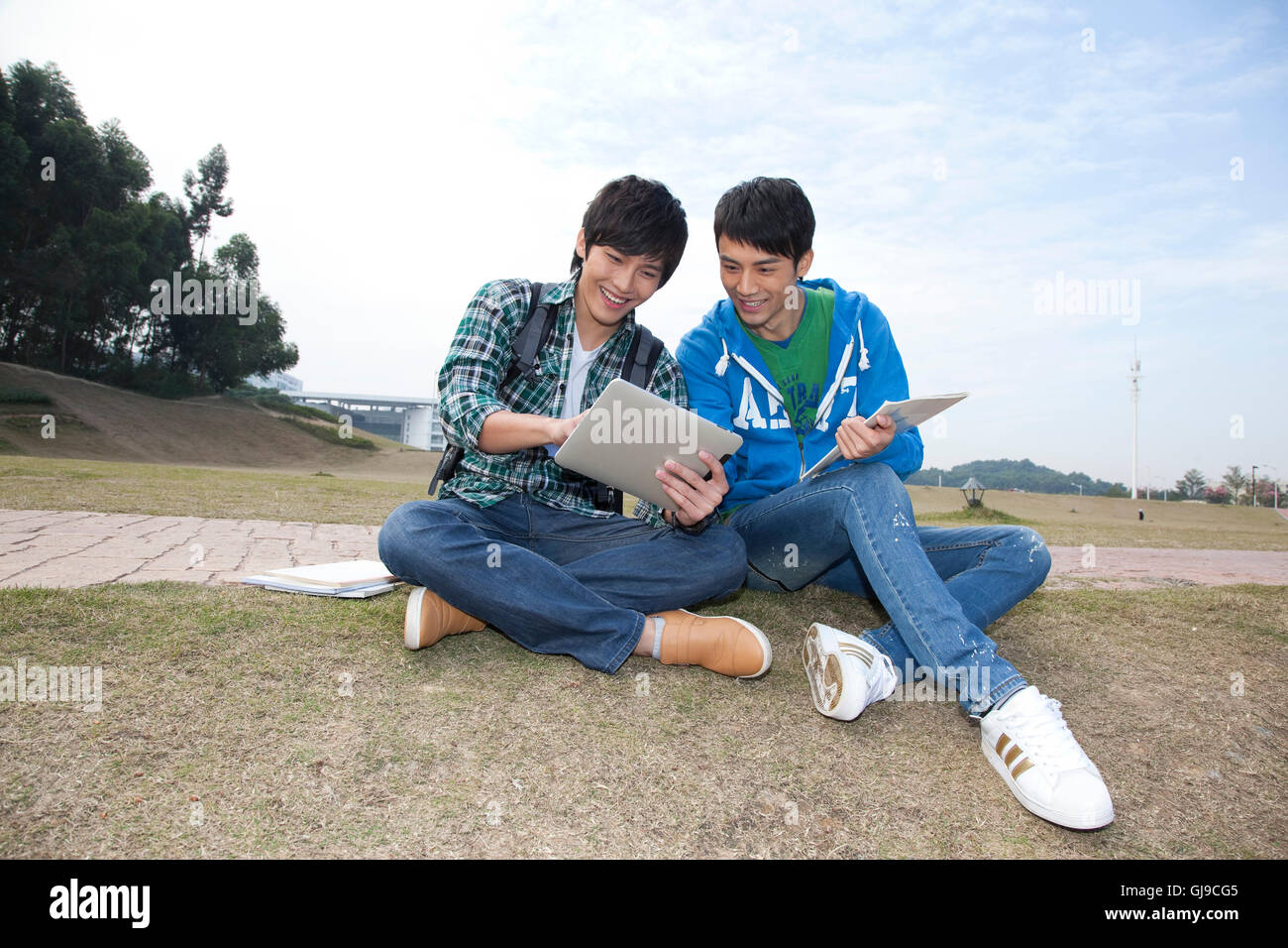 Young college students in a park outing Stock Photo - Alamy