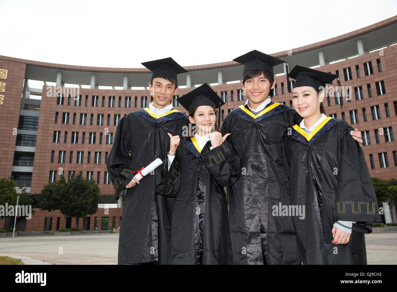 Young university student campus graduation ceremony Stock Photo - Alamy
