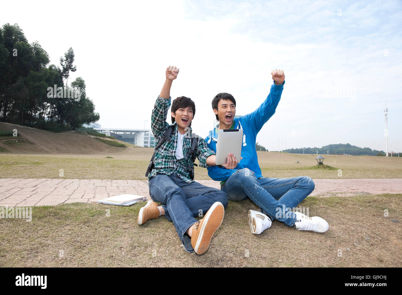 Young college students in a park outing Stock Photo - Alamy