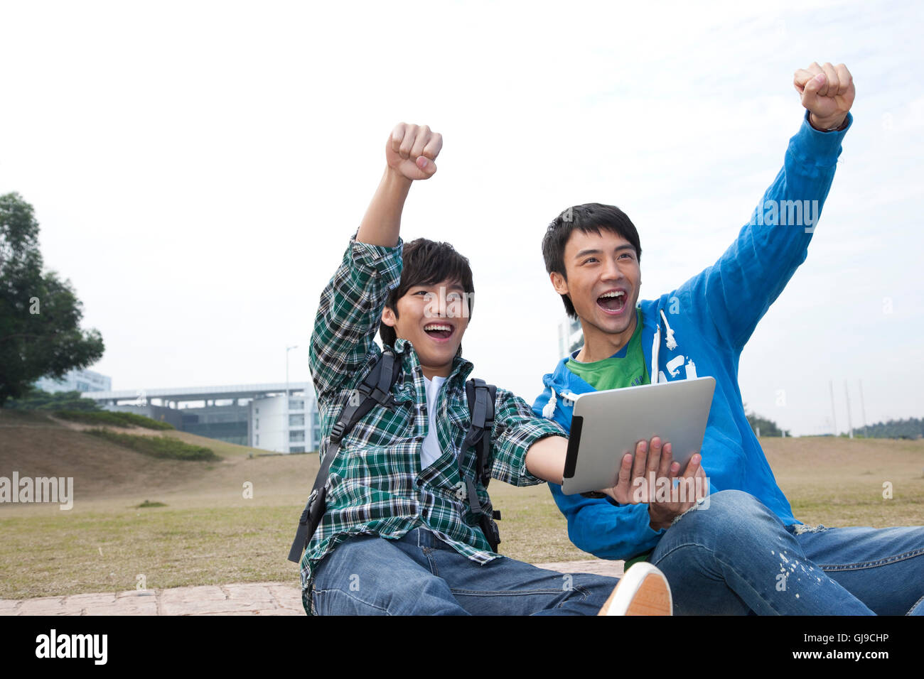 Young college students in a park outing Stock Photo - Alamy