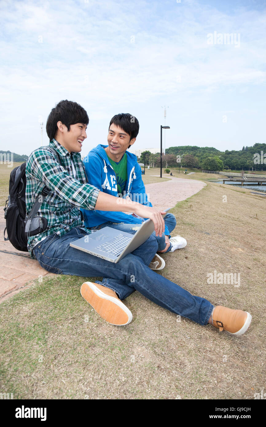 Young college students in a park outing Stock Photo - Alamy