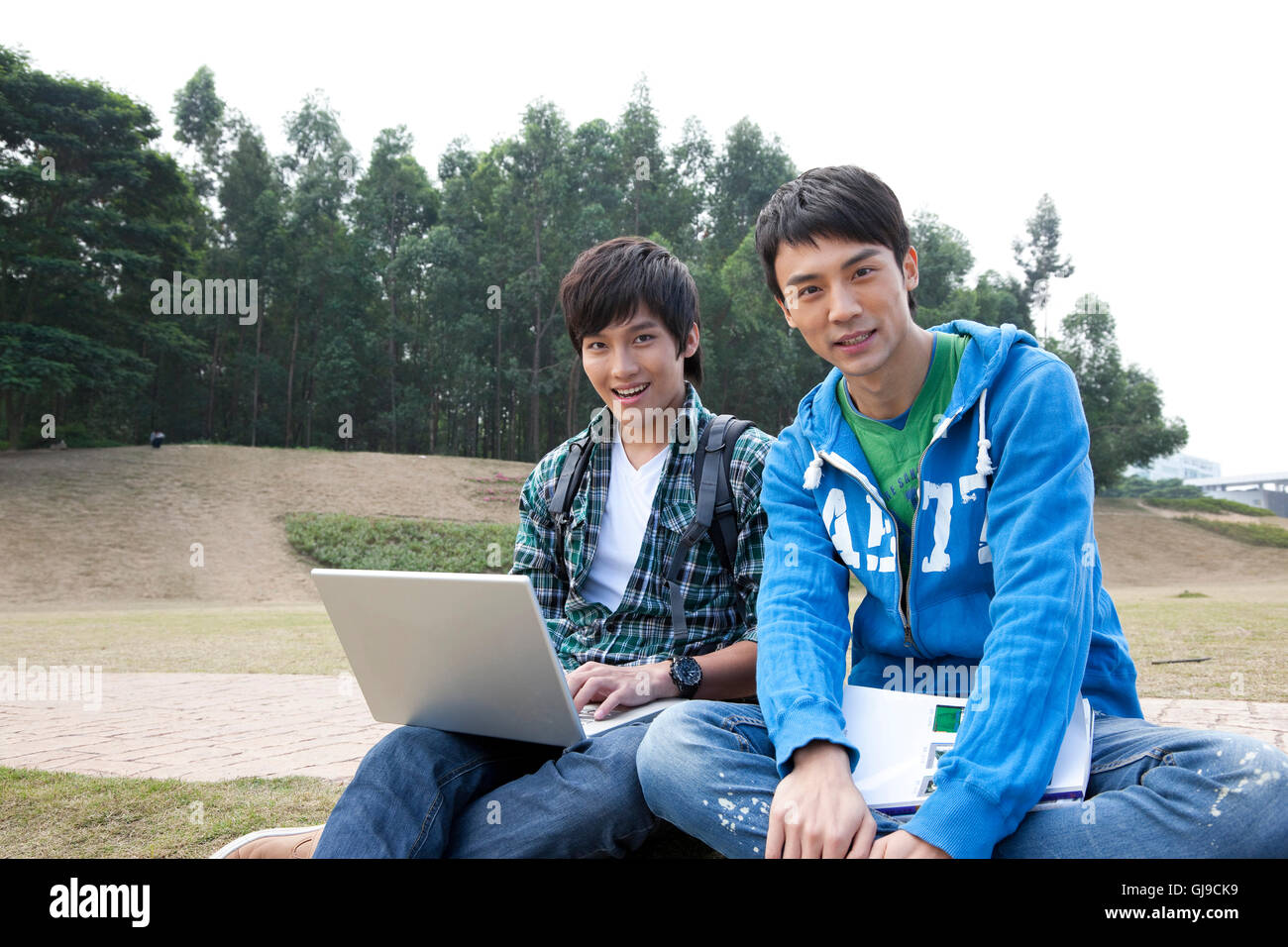 Young college students in a park outing Stock Photo - Alamy