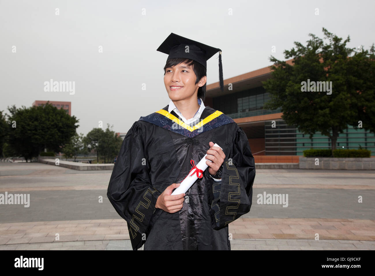Young university student campus graduation ceremony Stock Photo - Alamy
