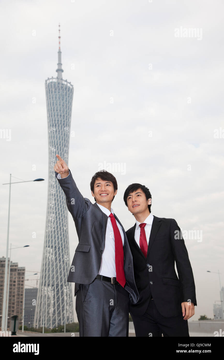 Young business man outside office building Stock Photo - Alamy
