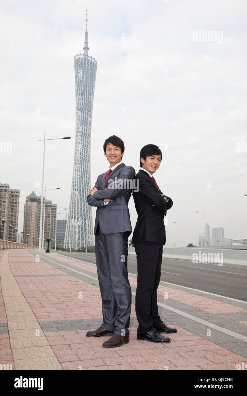 Young business man outside office building Stock Photo - Alamy