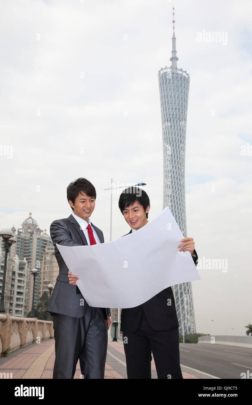 Young business man outside office building Stock Photo - Alamy