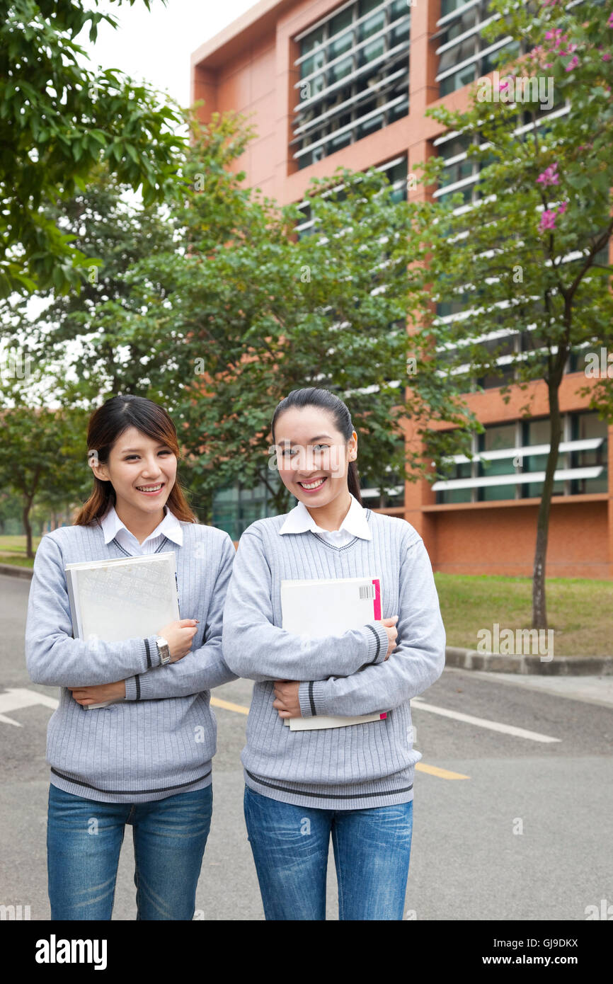 Young female students on campus stroll Stock Photo - Alamy