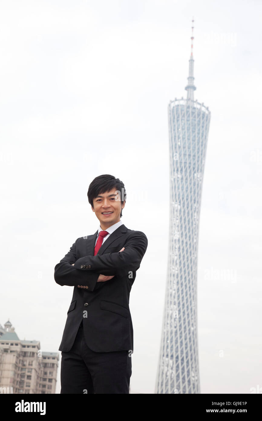 Young business man outside office building Stock Photo - Alamy