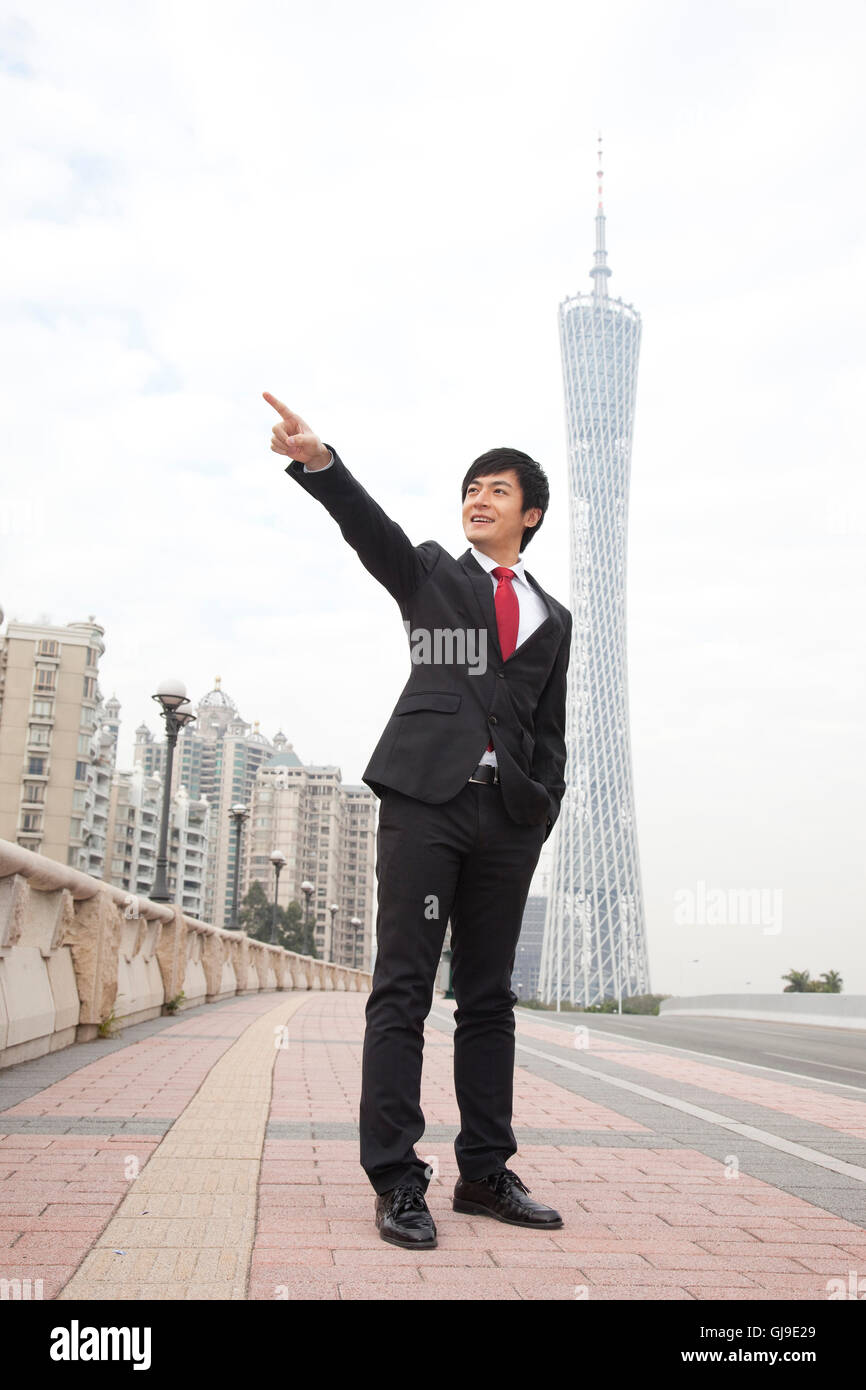 Young business man outside office building Stock Photo - Alamy