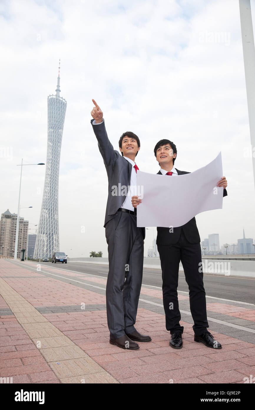 Young business man outside office building Stock Photo - Alamy