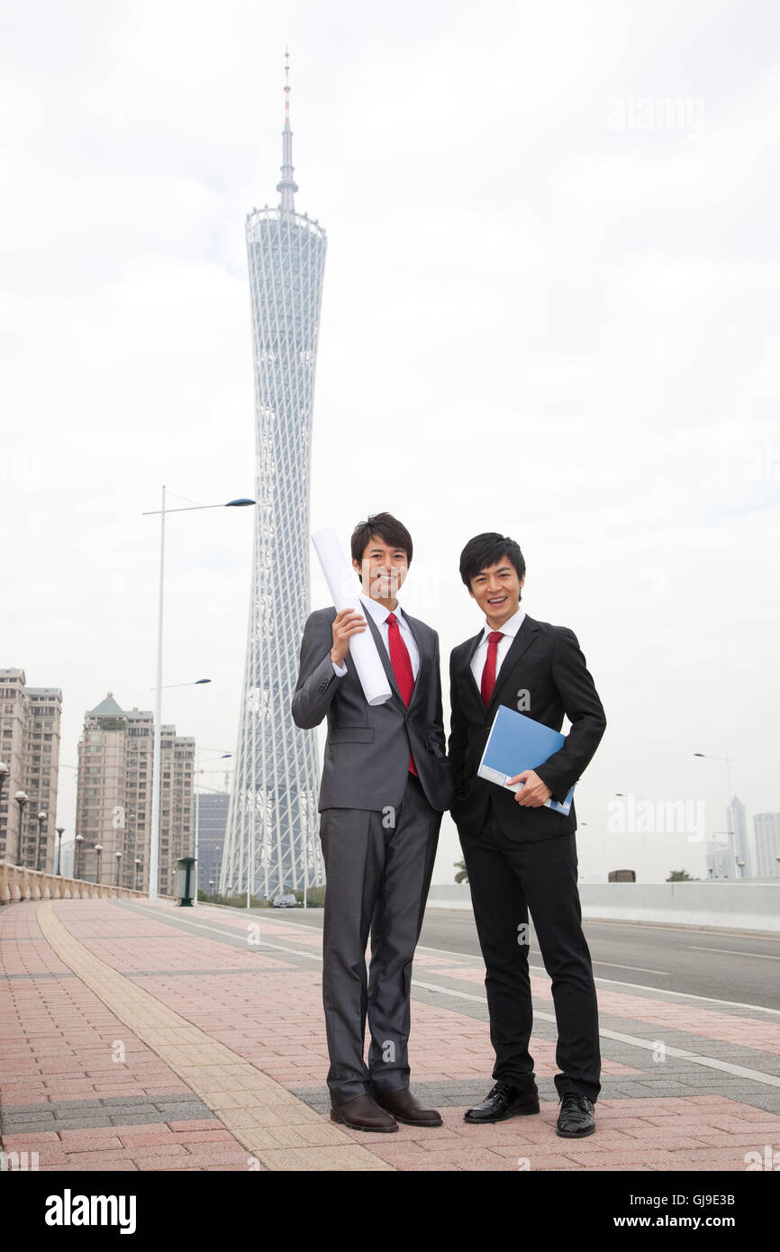 Young business man outside office building Stock Photo - Alamy