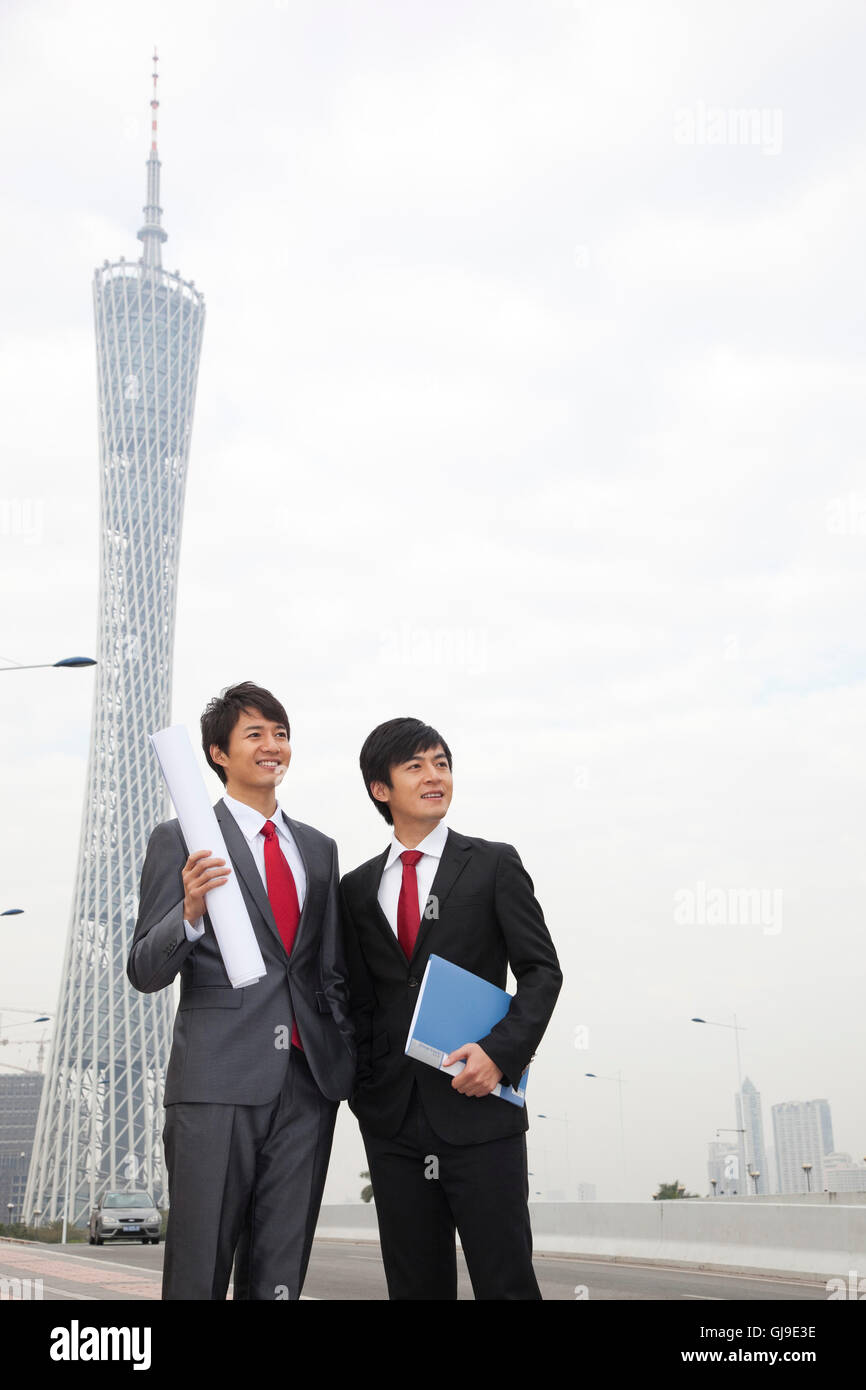 Young business man outside office building Stock Photo - Alamy