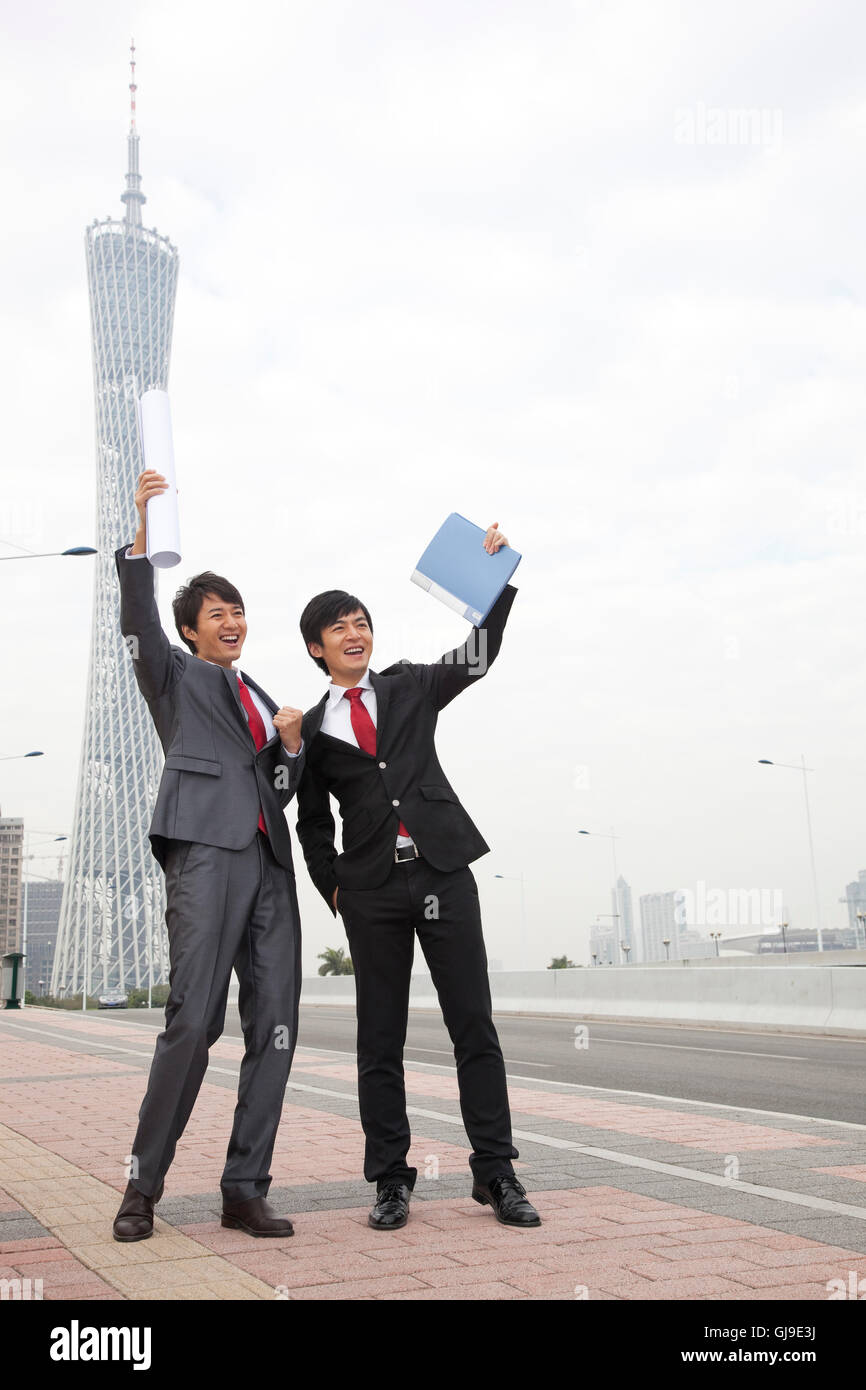 Young business man outside office building Stock Photo - Alamy