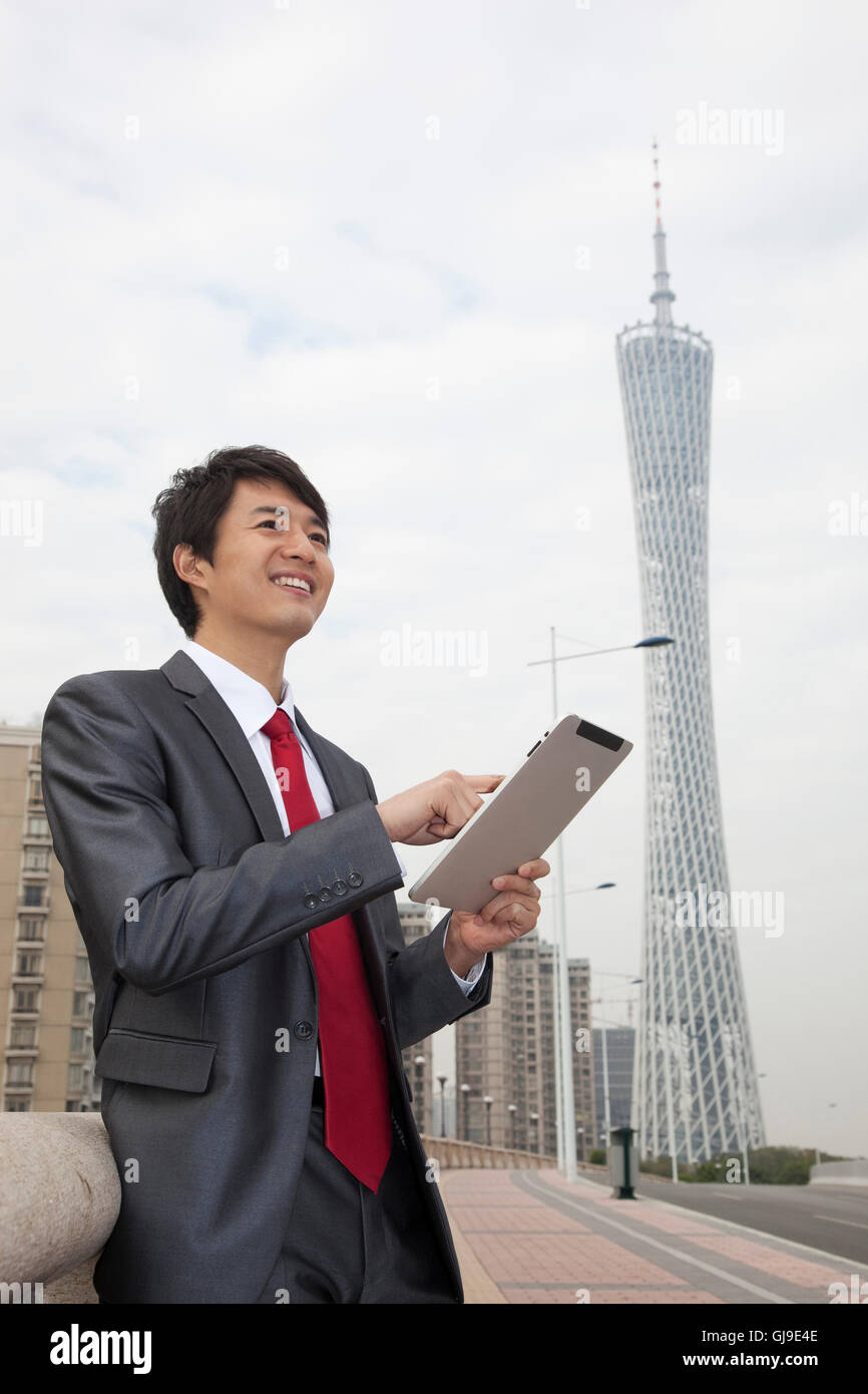 Young business man outside office building Stock Photo - Alamy