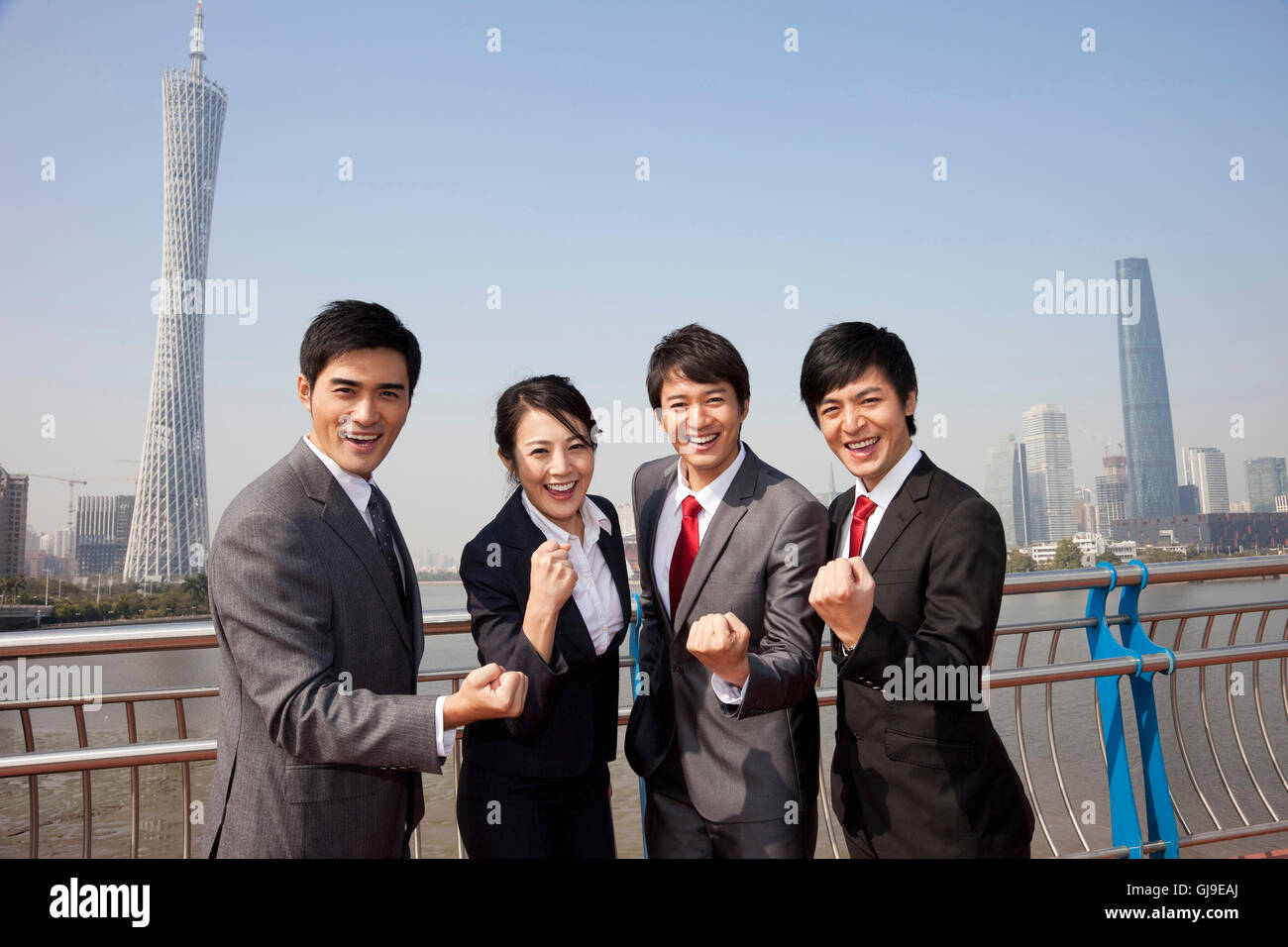 Young business men and ladies in business outside the office building ...