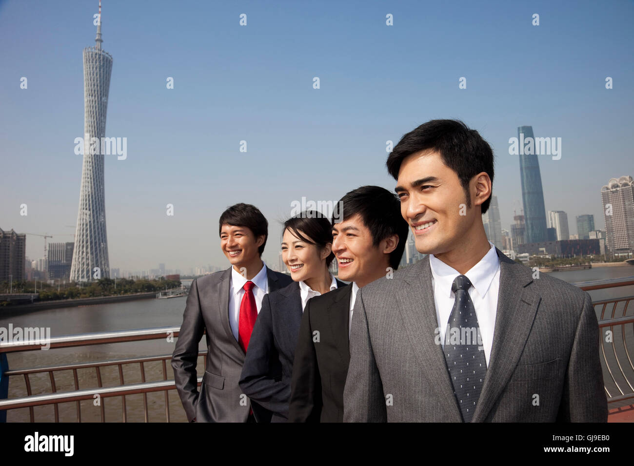 Young business men and ladies in business outside the office building ...