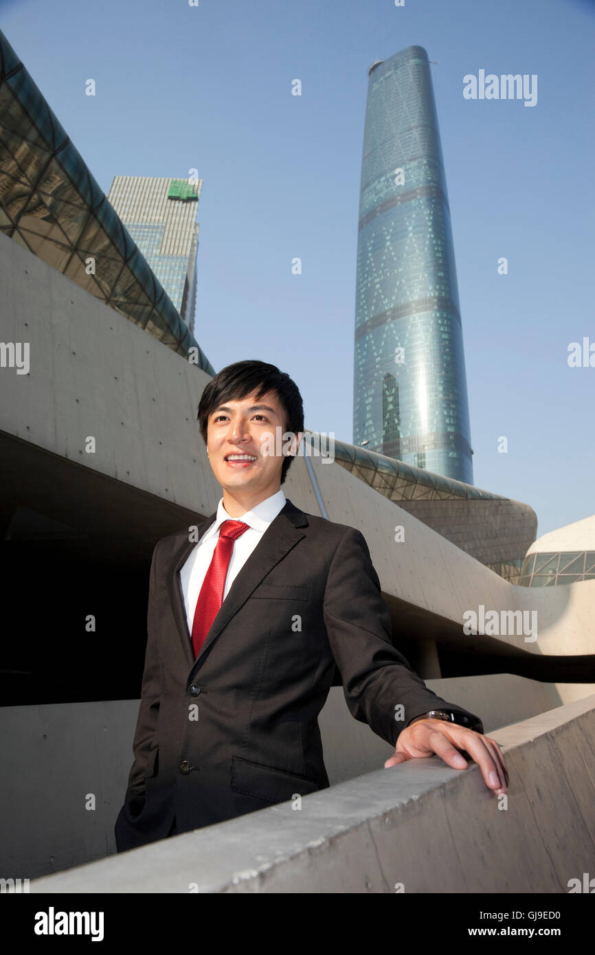 Young business man outside office building Stock Photo - Alamy