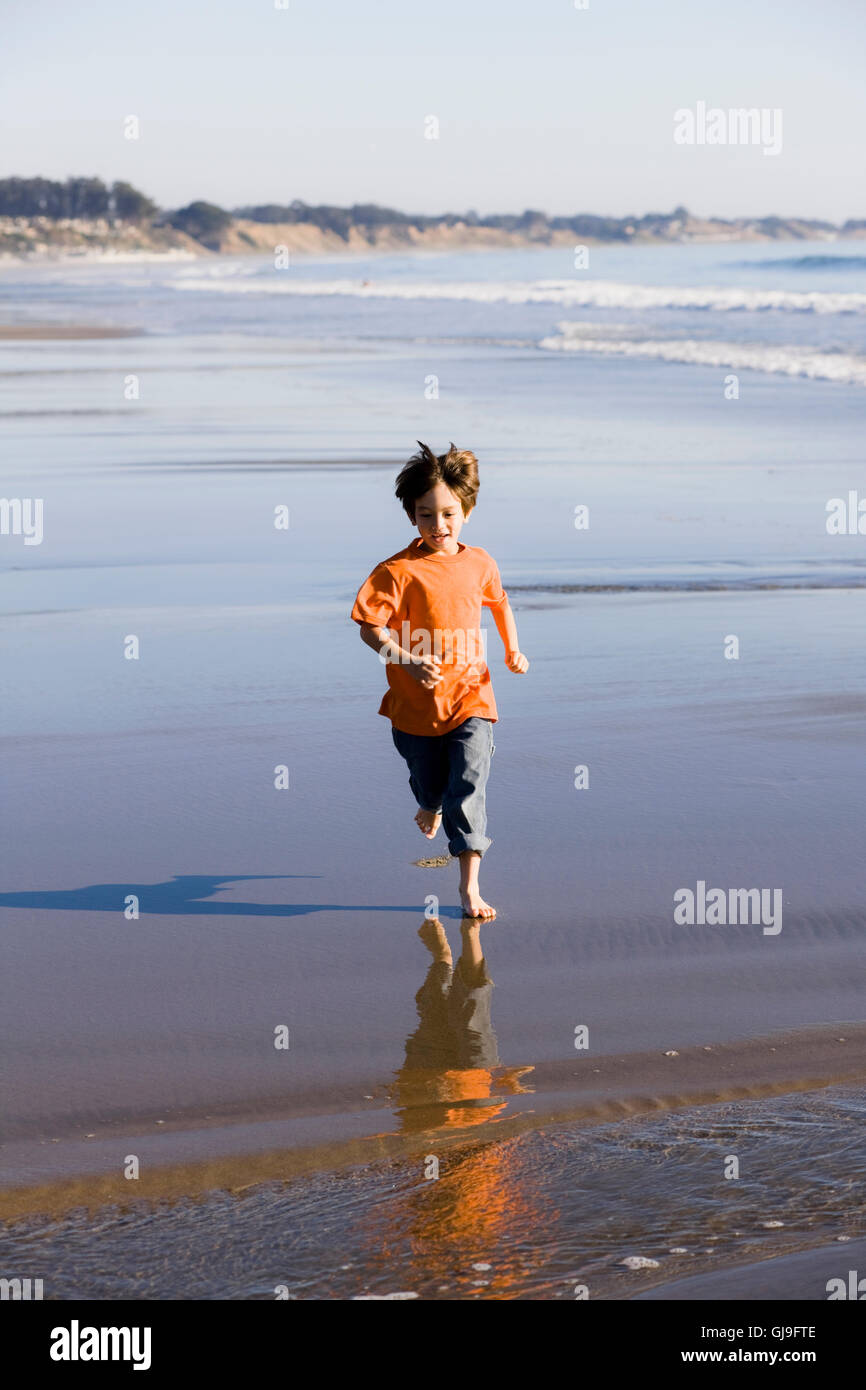 Boy At Beach Stock Photo - Alamy
