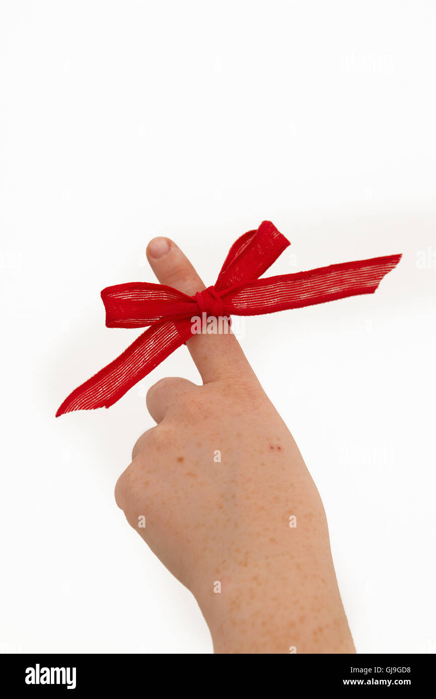 Pointing a ribbon on a finger Stock Photo - Alamy