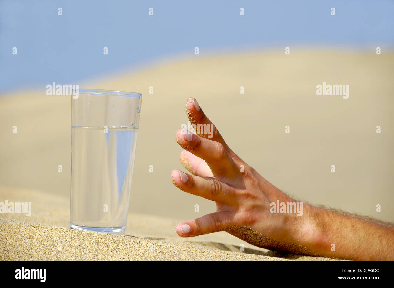 Hand reaching for water Stock Photo - Alamy