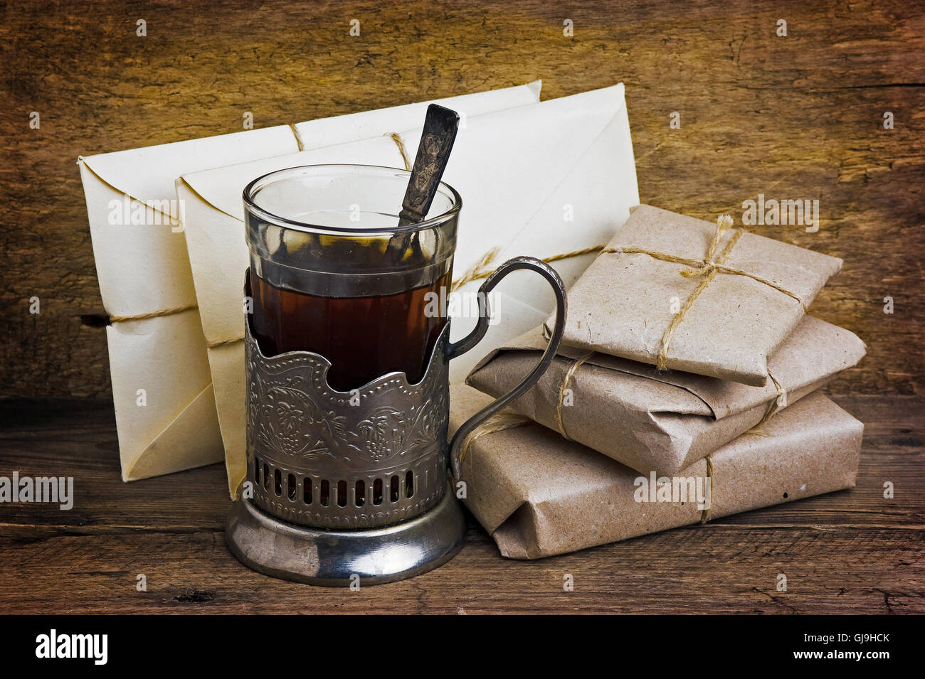 Postage on the background of an old board Stock Photo - Alamy
