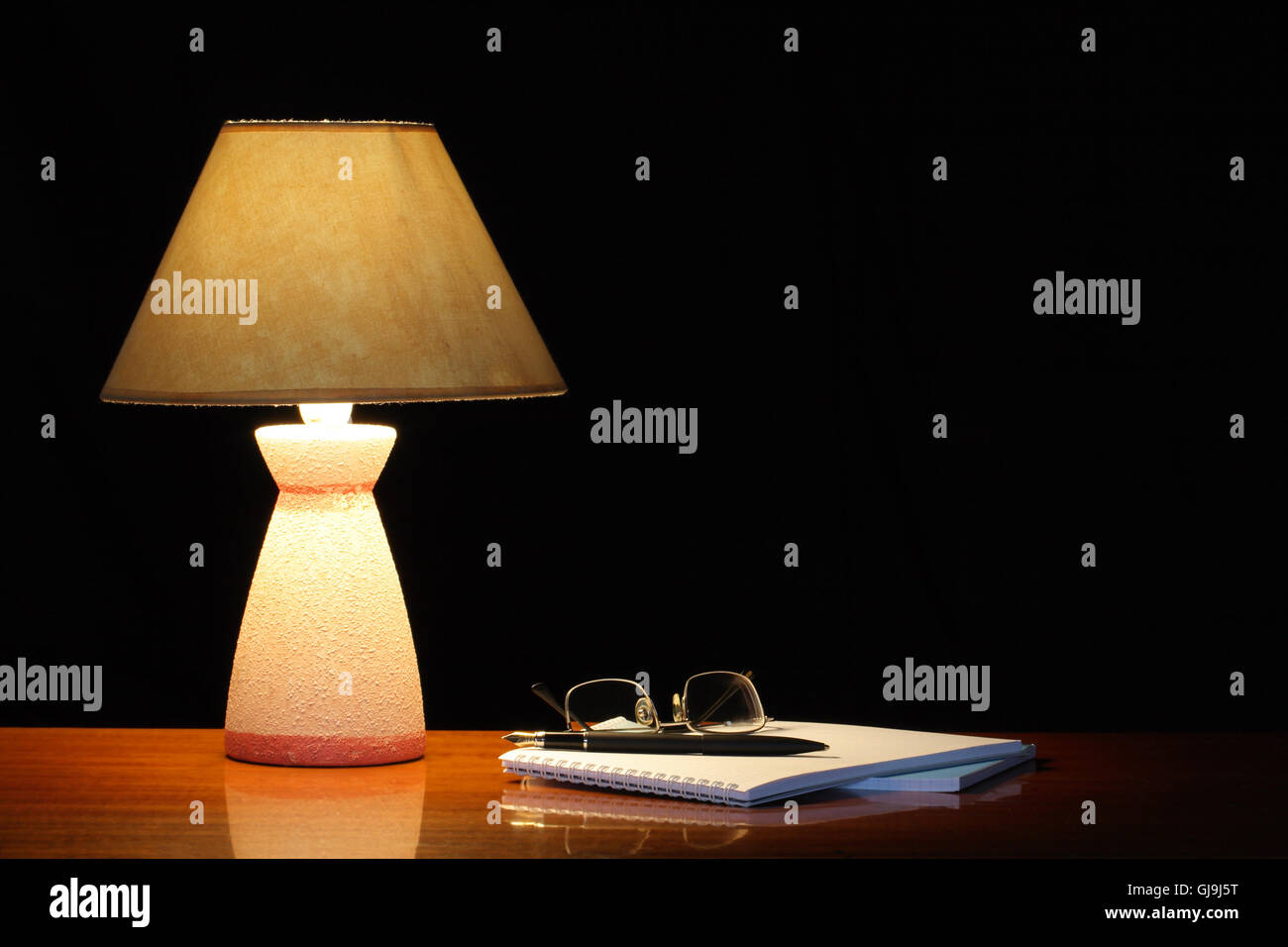 Lamp And Spiral Notebook Stock Photo - Alamy