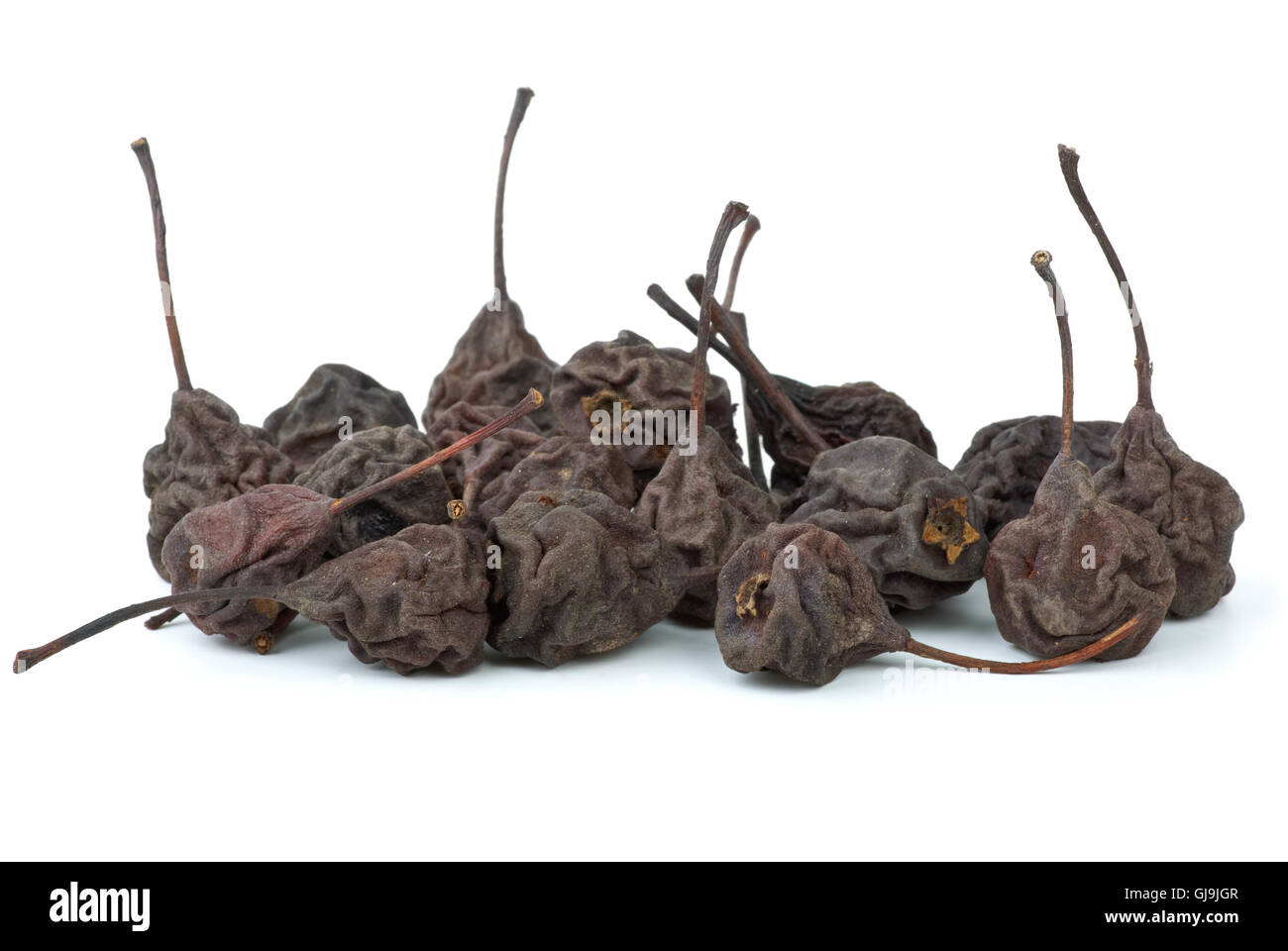 Few dried smoked pears isolated on the white background Stock Photo - Alamy