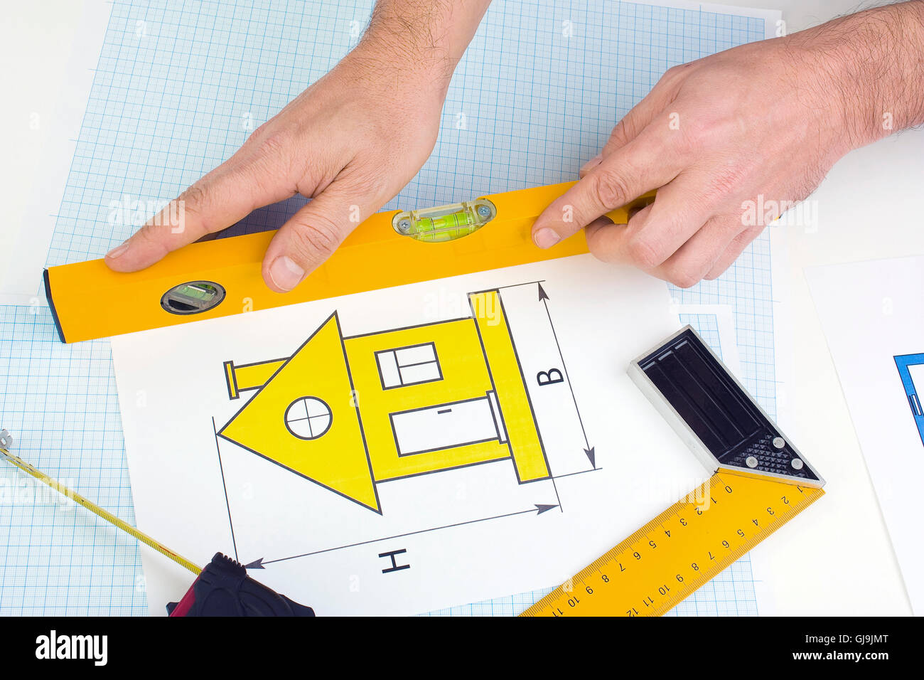 drawing at home with construction tools Stock Photo - Alamy