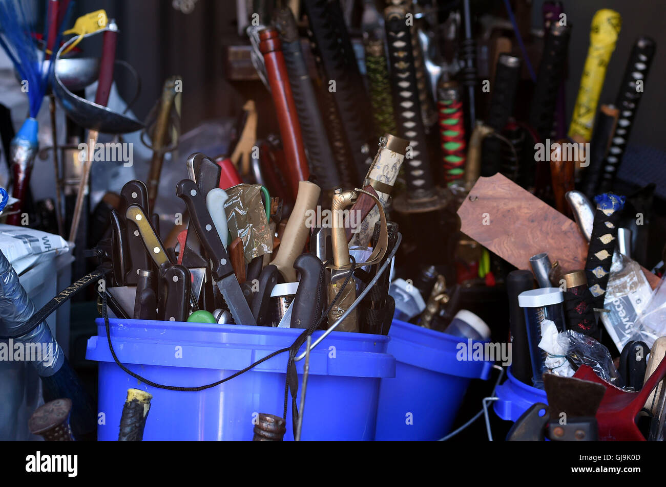 EMBARGOED TO 0001 MONDAY AUGUST 15 An array of seized and surrendered ...