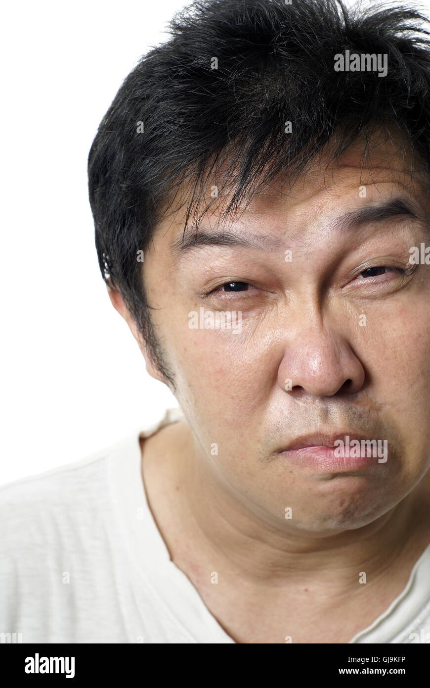 Miserable asian man portrait Stock Photo - Alamy