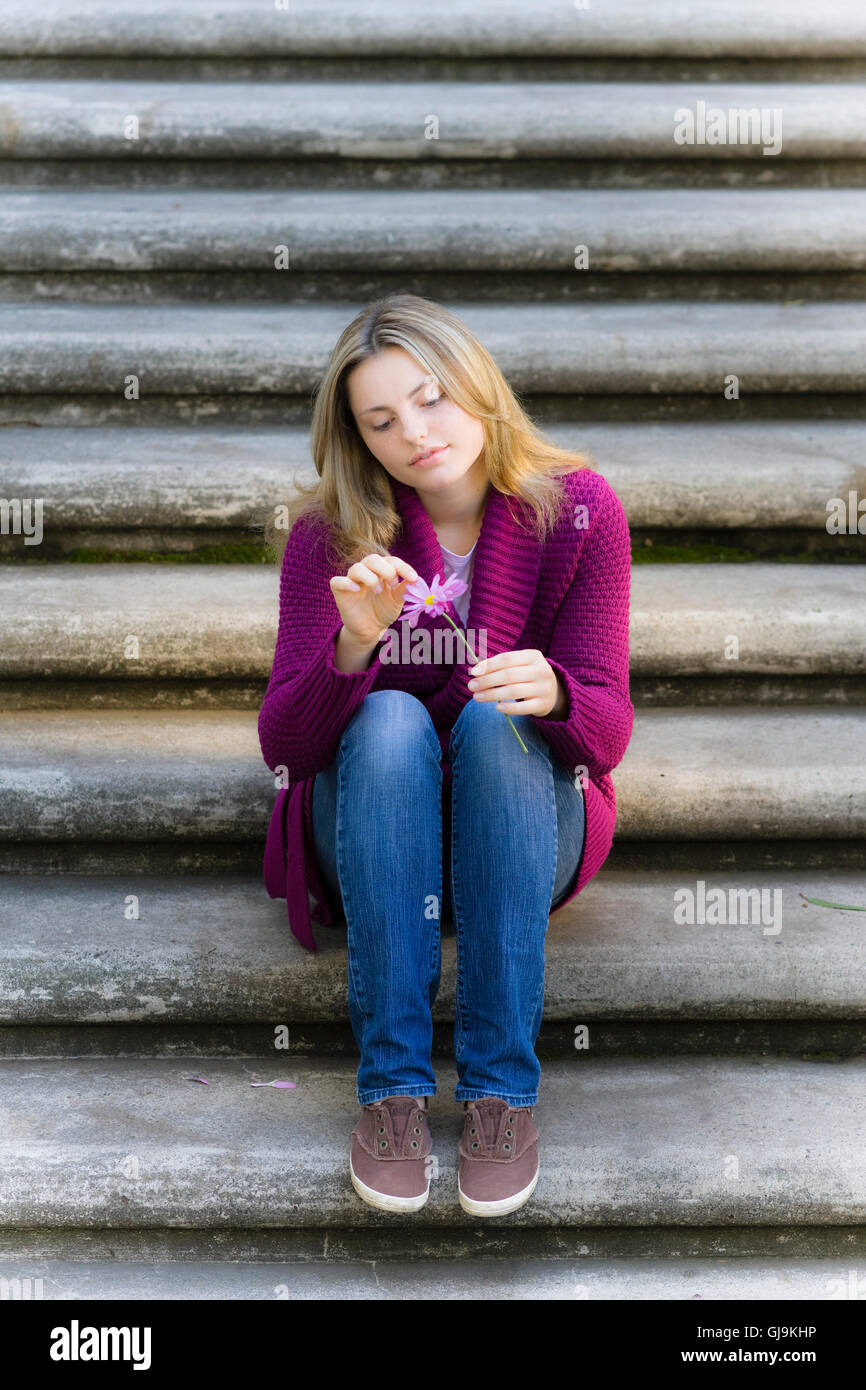 Teen Girl Sitting On Stairs Stock Photo - Alamy