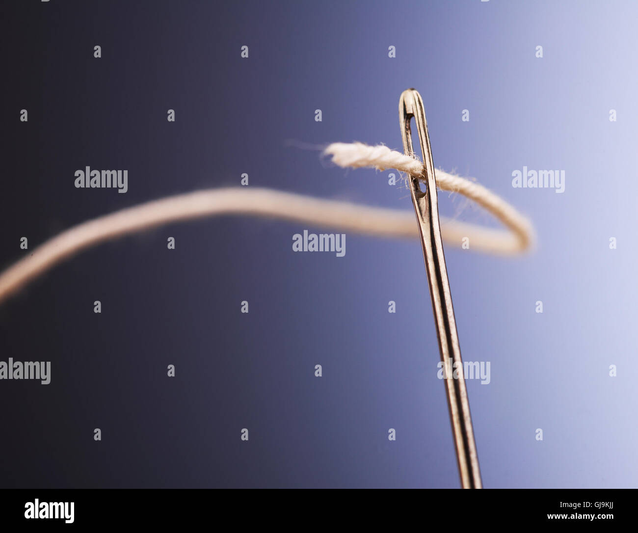 Needle with a thread Stock Photo - Alamy