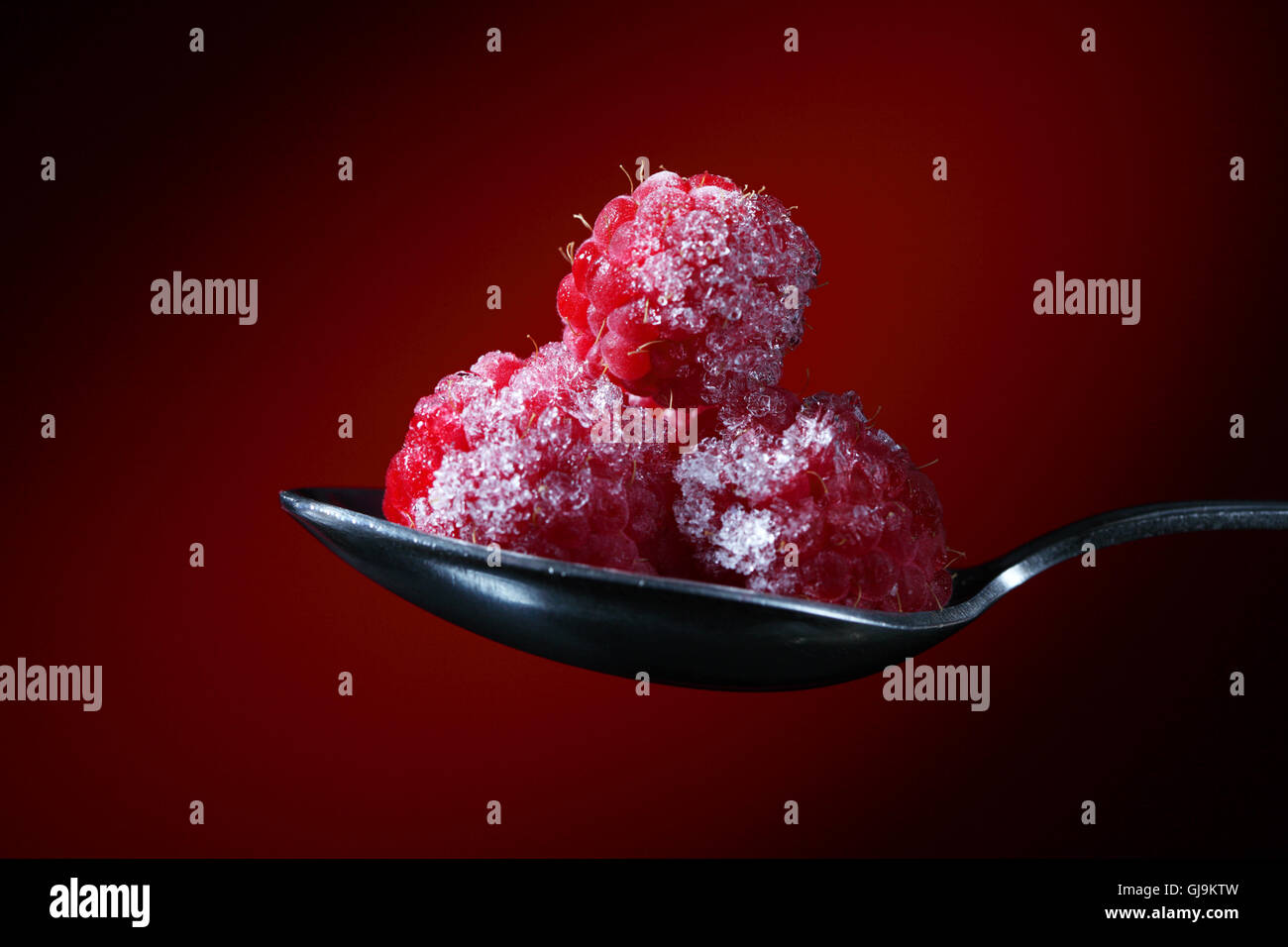 Color photo of pile of red rasberry on metal spoon Stock Photo - Alamy