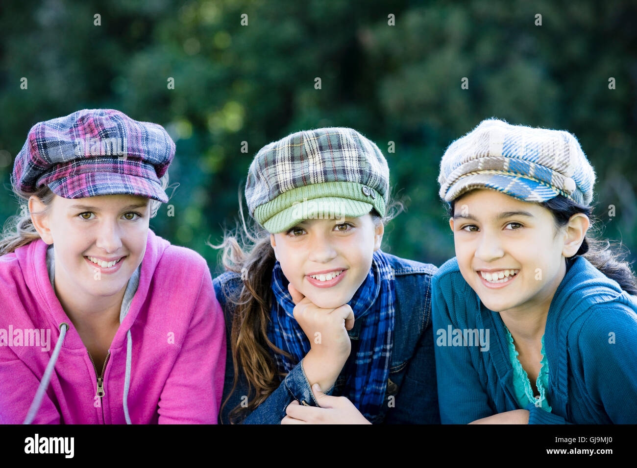 Group Of Tween Girls Lying On Grass Stock Photo - Alamy