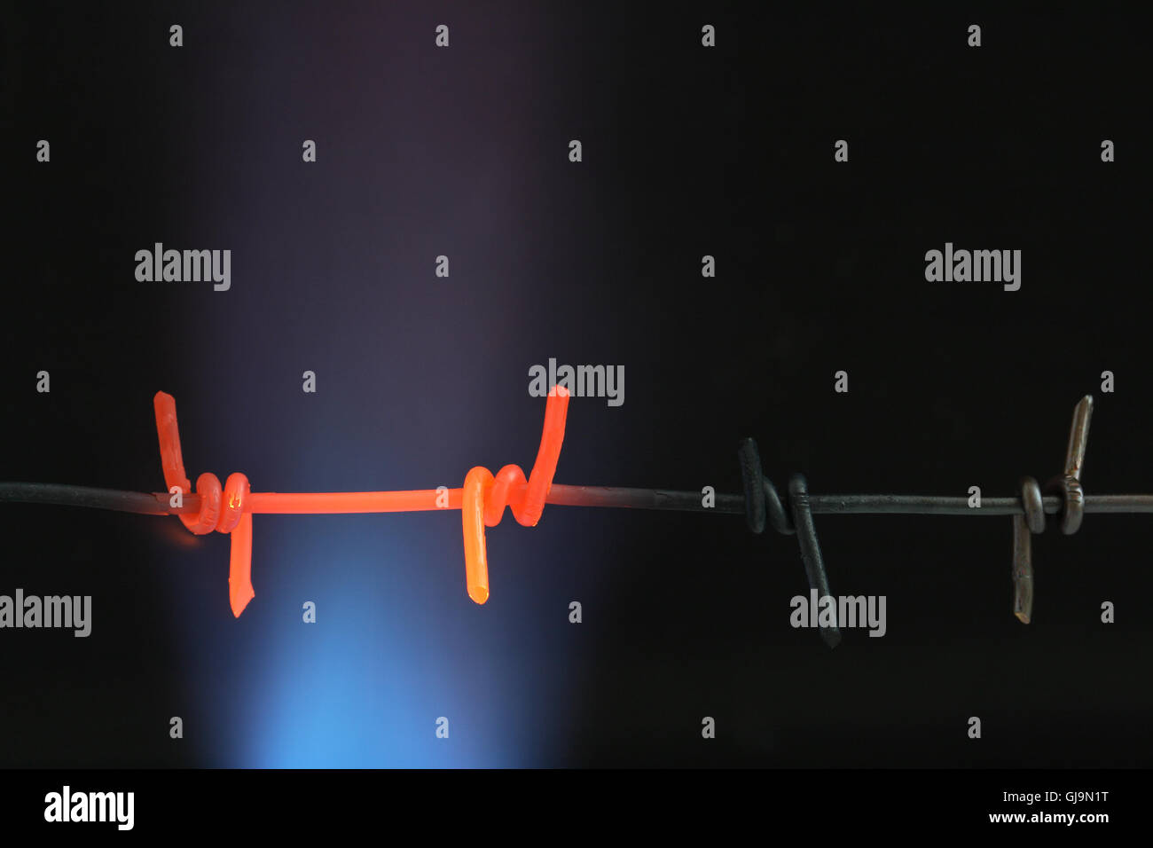 Red-Hot Barbed Wire Stock Photo - Alamy